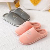 China Hot selling 2021 new fashion soft plush winter slippers smile patterns vamp non-slip couple home shoes in stock for sale