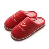 China Hot selling 2021 new fashion soft plush winter slippers smile patterns vamp non-slip couple home shoes in stock for sale