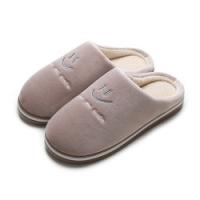China Hot selling 2021 new fashion soft plush winter slippers smile patterns vamp non-slip couple home shoes in stock for sale