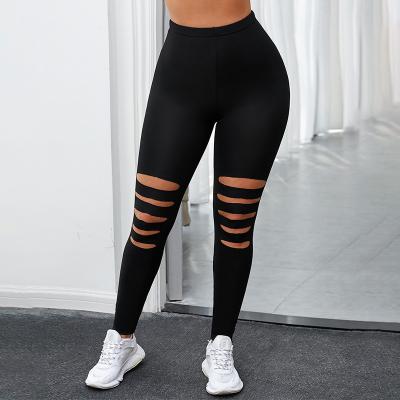 China Stylish cheap trousers ladies 2022 summer new leopard print fashion holes and tight nine-point pants women yoga leggings for sale
