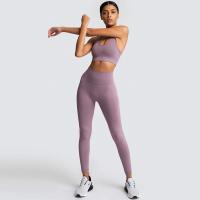 China Hot selling seamless yoga clothing set lift hip running fitness backless sports bra high waist pants tight women sportswear for sale