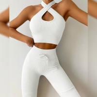 China 2021 summer new women's yoga suit solid color sexy suspenders crossover two pieces vest and tight trousers set for sale