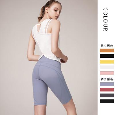 China 2021 new women sports set Irregular breathable vest solid color high waist quick dry exercise fitness peach buttocks shorts for sale