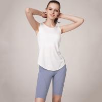 China 2021 new women sports set Irregular breathable vest solid color high waist quick dry exercise fitness peach buttocks shorts for sale