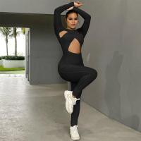 China hot sale women long sleeve jumpsuit 2021 new design solid color hollow out bodycon cross bandage sportswear in stock for sale