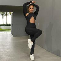 China hot sale women long sleeve jumpsuit 2021 new design solid color hollow out bodycon cross bandage sportswear in stock for sale