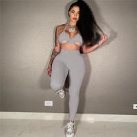 China ladies new sexy low-cut halter vest hanging neck crop tops tight long pants leisure two-piece sportswear for sale