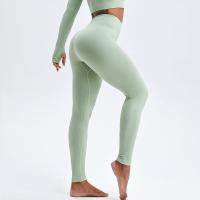 China New custom yoga pants women seamless high waist peach hip lift tight solid color fitness pants summer trousers women for sale