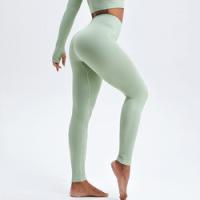 China New custom yoga pants women seamless high waist peach hip lift tight solid color fitness pants summer trousers women for sale