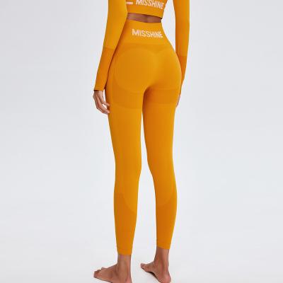 China New products seamless fitness pants peach hip lift yoga pants women tight skin-friendly sports trousers for sale