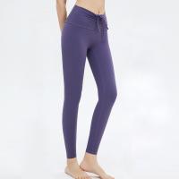 China Spot wholesale bowknot drawstring yoga pants women high waist hip lift sports pants tight fitness pants trousers women for sale
