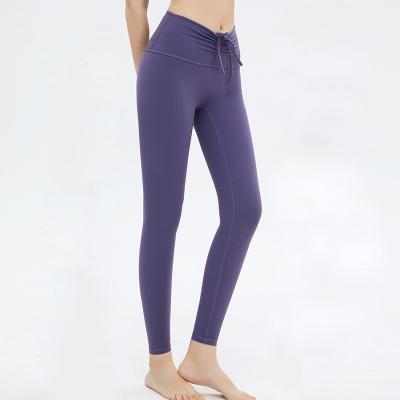 China Spot wholesale bowknot drawstring yoga pants women high waist hip lift sports pants tight fitness pants trousers women for sale