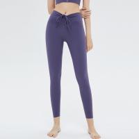 China Spot wholesale bowknot drawstring yoga pants women high waist hip lift sports pants tight fitness pants trousers women for sale