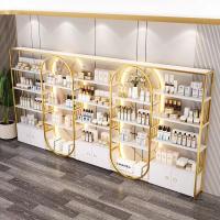 China Versatile Cosmetic Luxury Display Cabinets MultiLayer Marble Shelving Golden Body for sale