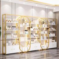 China Versatile Cosmetic Luxury Display Cabinets MultiLayer Marble Shelving Golden Body for sale