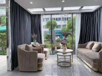 China Nordic Light Luxury Hotel Lobby Furniture Velvet Stainless Steel Postmodern Showroom Sofa for sale