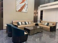 China High End Hotel Lobby Furniture Genuine Leather Stainless Steel Armrest Single Lounge Chair for sale
