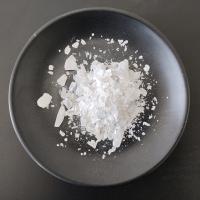 China Magnesium Chloride Anhydrous MgCl2 99% White Flake for Smelting Industrial Grade for sale