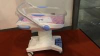 China Hospital Child bed baby crib Hydraulic System Control 25kg Load Hospital Baby Trolley White for sale