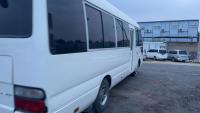 China Left Hand Drive Toyota Coaster Bus at with 9.00R20 Tires and 4L Engine Capacity for sale