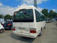 China 17-30 Seat Capacity Left Drive Toyota Coaster Bus in South Africa Comfortable Style for sale