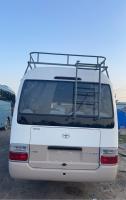China 8500kg Total Mass Used Coaster Bus with Overhead Luggage Rack and 4-6L Engine Capacity for sale