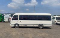 China 3935mm Wheel Base Toyota Coaster Bus with 19-29 Seats Closing Windows Sliding Doors for sale