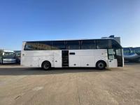 China Comfortable 65 Seater Bus Coach with 6 8L Engine Capacity and Leaf Spring Suspension for sale