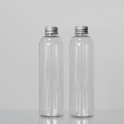 China Transparent Color PET Material 200ml Round Plastic Bottle Designers For Cosmetic for sale