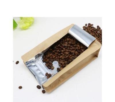 China Custom 100g Resealable Stand Up Kraft Paper Coffee Bag with One Way Valve and Foil Lining for sale