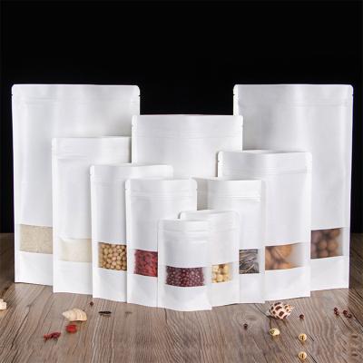 China Custom Stand Up Kraft Paper Zipper Bag with Clear Window Food Grade 20-200 Micron for sale