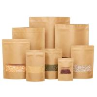 China Custom Kraft Stand Up Pouches with Window Resealable Zipper Food Storage Bags 20-200 Micron for sale
