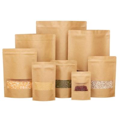 China Custom Kraft Stand Up Pouches with Window Resealable Zipper Food Storage Bags 20-200 Micron for sale