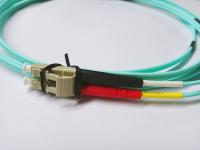 China OM3 / OM4 UPC LSZH Fiber Optic Patch Cord with Red Black Boot for sale