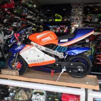 China 49CC Mini Sports Motorcycle with 1.8L Fuel Tank and 6-Inch Wheels - Hand Pull Start Off-Road Bike for sale