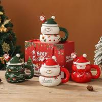 China Luxury Christmas Ceramic Santa Mug 400ml Custom Logo Design White Red Green for sale