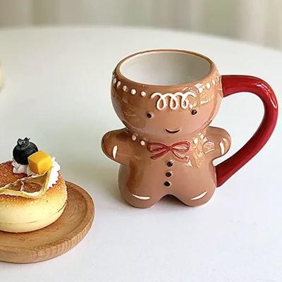 China Christmas Day Custom 300ml Cute Gingerbread Man Shape Cuddle Cup Ceramic Coffee Mug for sale