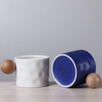 China Nordic Ceramic Coffee Mug 330ml with Wooden Ball Handle Porcelain Reusable Cup for sale