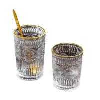 China OEM Retro Embossed Sunflower Tumbler Glass Heat Resistant Water Cup 300ML 380ML for sale