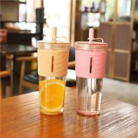 China Double Wall Plastic Reusable Bubble Tea Cup with 700ml Capacity and Silicone Sleeve for sale