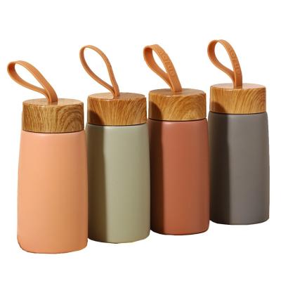 China 280ml 304 Stainless Steel Insulated Water Bottle with Wood Grain Finish Custom Logo Kids Sports Cup for sale