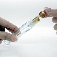 China Custom Made Small Clear Crimp Neck Round 10ml Thick Bottom Empty Glass Perfume Bottle With Atomizer for sale