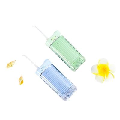 China Multifunctional Handheld Water Flosser Teeth Cleaner For Adult 3 Modes for sale