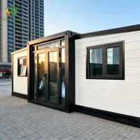 China 30FT Expandable Container House 56sqm Dual Wing Fold-Out Steel Frame Prefab Home Unit for sale