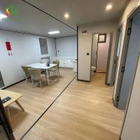 China 20FT Expandable Container House 37sqm Dual Wing Steel Frame Prefab Home and Site Office for sale