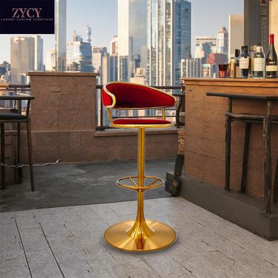China Red Velvet Swivel Bar Stool Luxury Bar Furniture Gold Metal Height Adjustable Footrest Fabric for sale