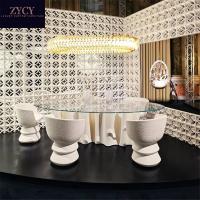 China Designer Wave Shaped Tempered Glass Dining Table Luxury Dining Room Furniture Villa Art Flower Elliptical for sale