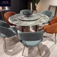 China Glass Round Dining Table Set Marble Rotating Surface Leather Upholstered Stainless Steel Chairs for Home for sale