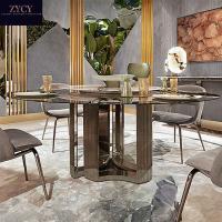 China Glass Round Dining Table Set Marble Rotating Surface Leather Upholstered Stainless Steel Chairs for Home for sale