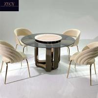 China Glass Round Dining Table Set Marble Rotating Surface Leather Upholstered Stainless Steel Chairs for Home for sale